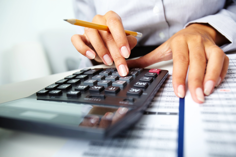 woman-calculating-costs » Succeed As Your Own Boss