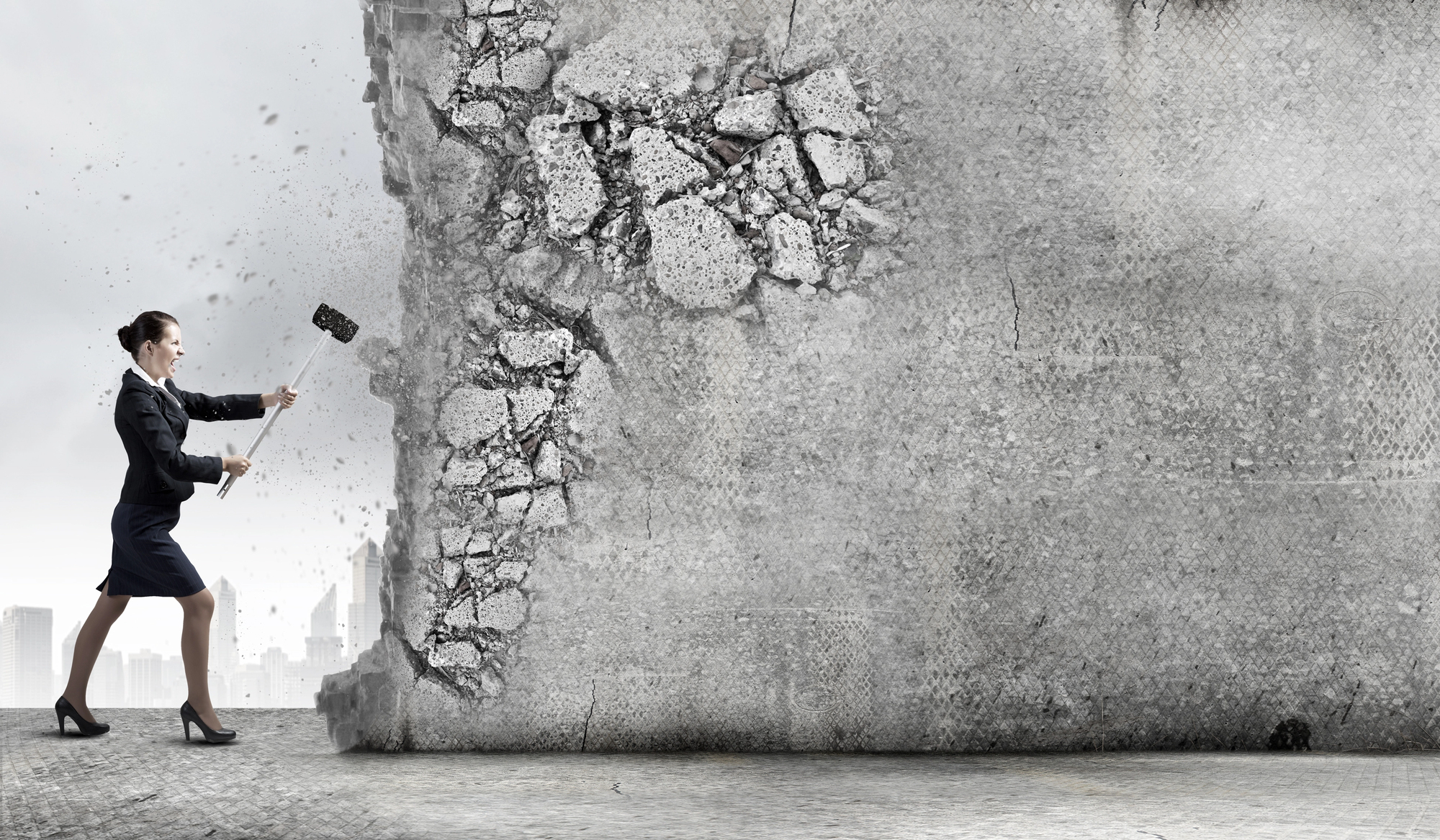 businesswoman-destroying-wall » Succeed As Your Own Boss
